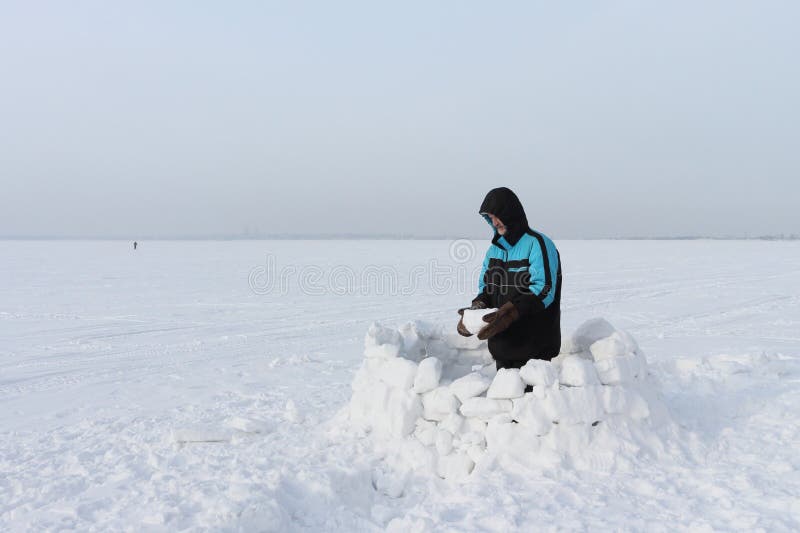 The man building a igloo stock image. Image of recreation - 50375859