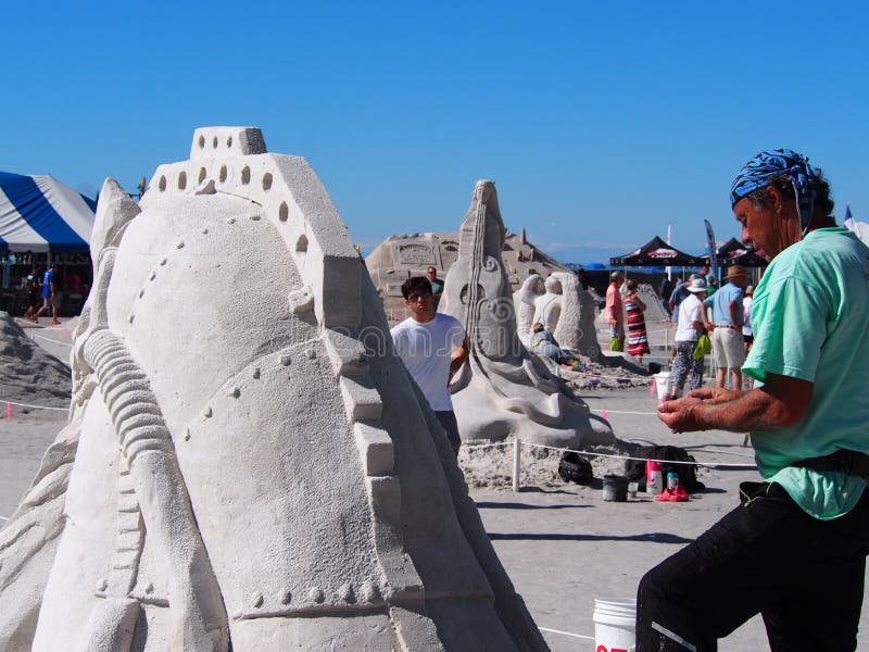 Man building Sand Castle editorial image. Image of maker - 84529950