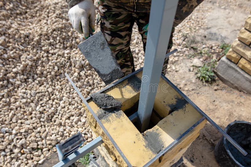 Man Builds a Brick Wall at a Construction Site Stock Image - Image of ...