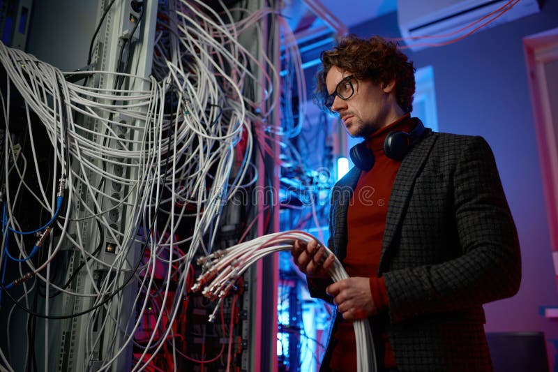 It Man with Bunch of Cables in Hands in Server Room Stock Photo - Image ...