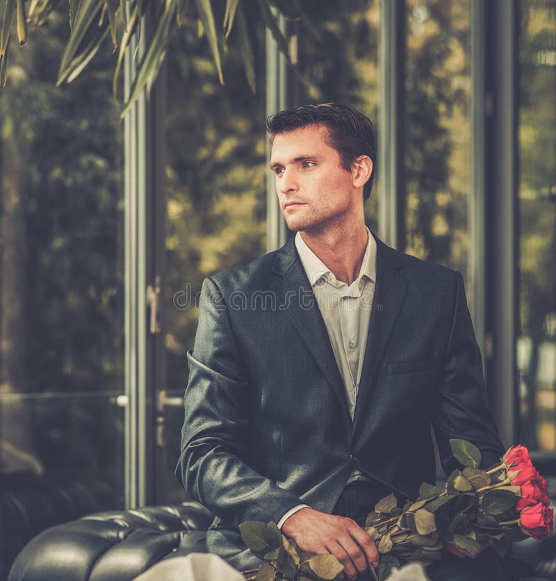Man with Bunch of Red Roses Waiting His Lady Stock Image - Image of ...