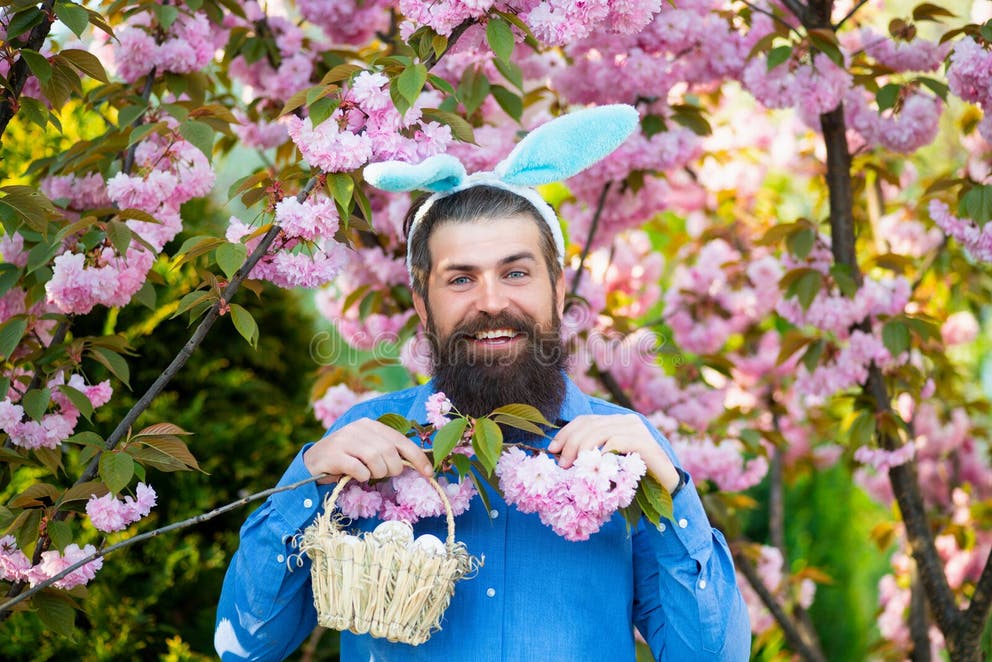 Man in Bunny Ears Holds Easter Egg. Rabbit Man. Man with Rabbit Ears ...