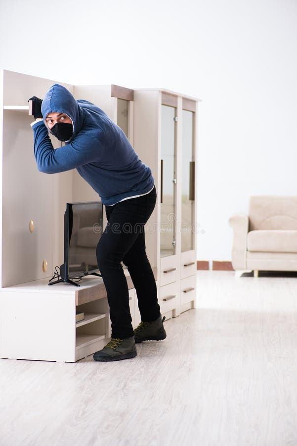 The Man Burglar Stealing Tv Set from House Stock Photo - Image of flat ...
