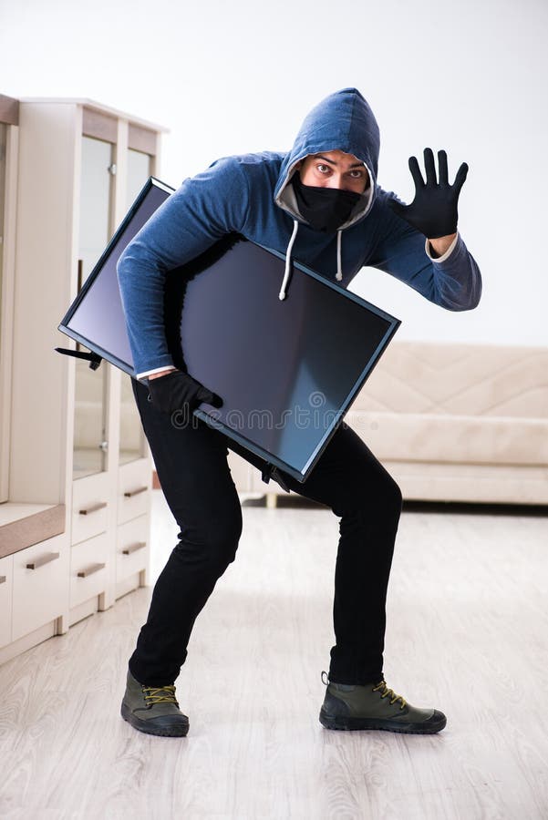 The Man Burglar Stealing Tv Set from House Stock Image - Image of mask ...