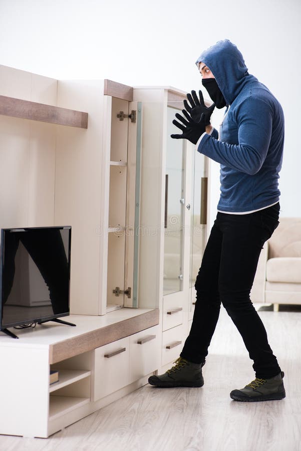 The Man Burglar Stealing Tv Set from House Stock Photo - Image of ...