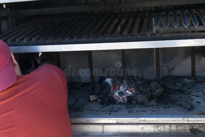 Man burning coal stock photo. Image of chef, argentine - 105133788