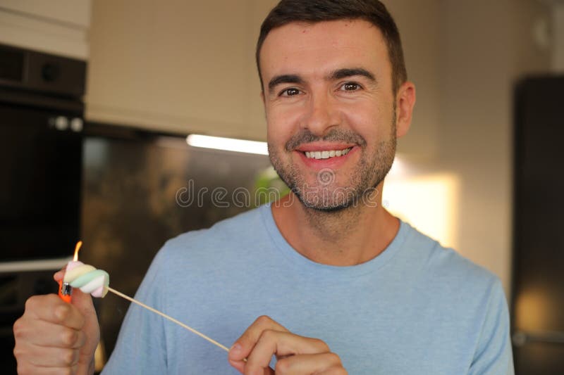 Man Burning His Favorite Candy Stock Image - Image of marshmallows ...