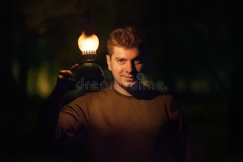 Man with a Burning Lamp in the Dark Forest Stock Image - Image of ...