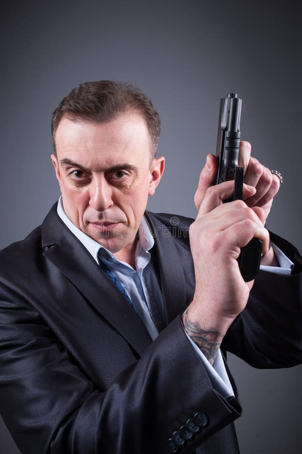 Man in a Business Suit with a Gun Stock Photo - Image of brutal ...