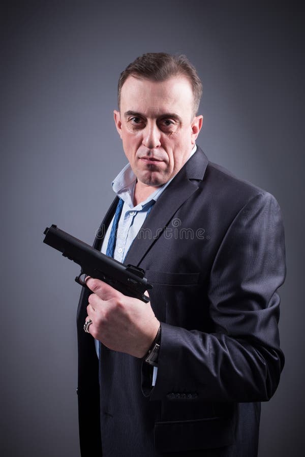Man in a Business Suit with a Gun Stock Photo - Image of security, move ...