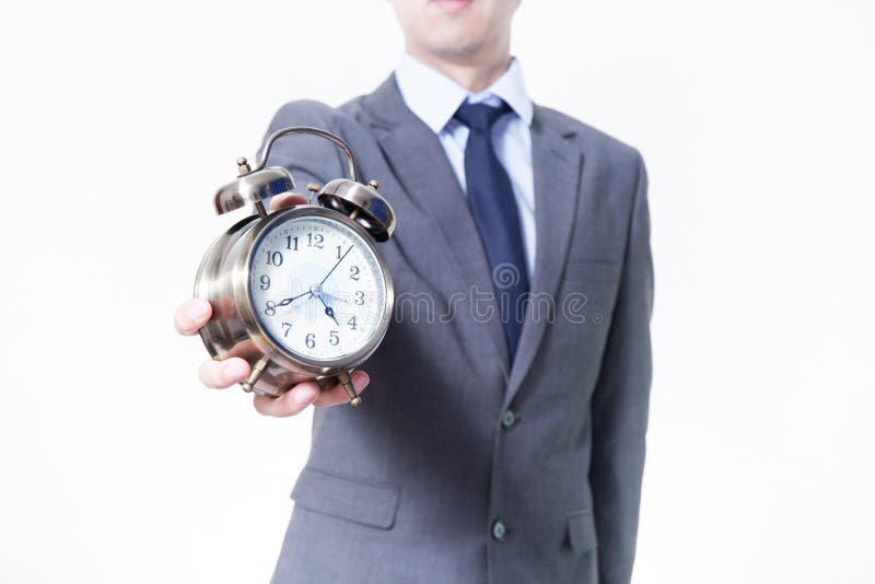 Man in Business Suit Holding a Clock - on Time and Business Concept ...