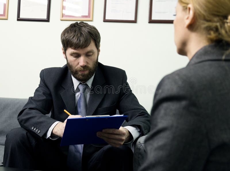 Man in a Business Suit Holding a Job Interview. Ready for Interview ...
