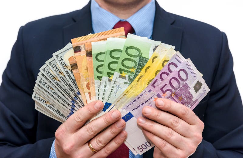 Man in Business Suit Holds Euro Denominations Stock Photo - Image of ...