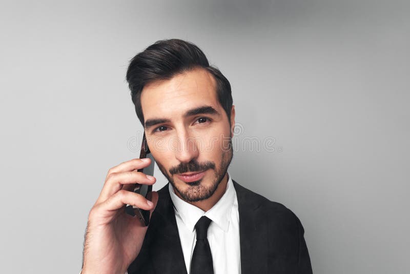 Man Businessman in a Suit Talking on the Phone Solving Important Issues ...