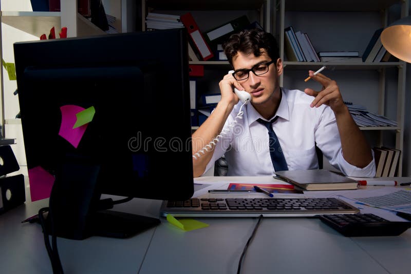 The Man Businessman Working Late Hours in the Office Stock Photo ...