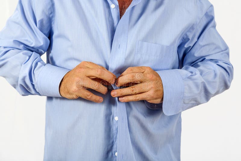 Man buttoning his shirt stock photo. Image of color, authentic - 36530162