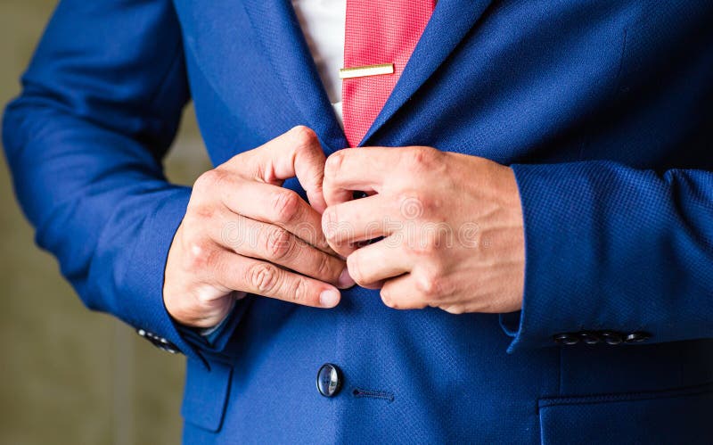 Man Buttoning Jacket Close-up Stock Photo - Image of pose, modern: 70244816