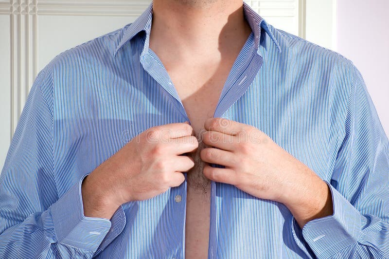 Man Buttoning Shirt stock image. Image of morning, shirt - 16958473