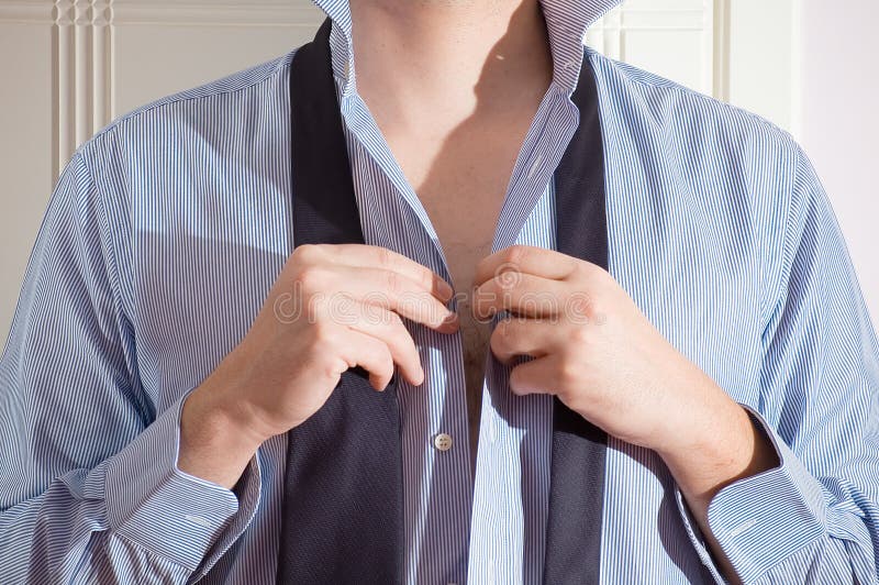 Man Buttoning Shirt with Tie Stock Photo - Image of blue, formal: 16958206