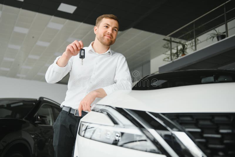 Man Buying a Car at a Showroom Stock Photo - Image of buying ...