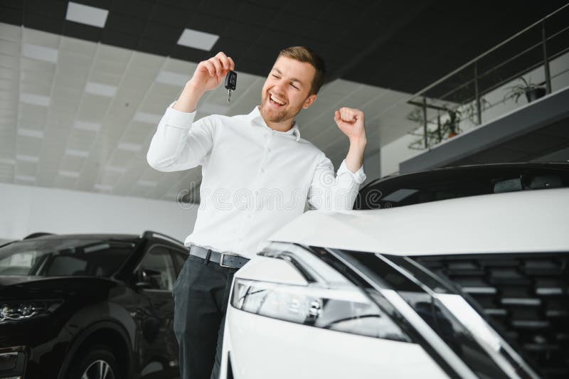Man Buying a Car at a Showroom Stock Photo - Image of handsome ...