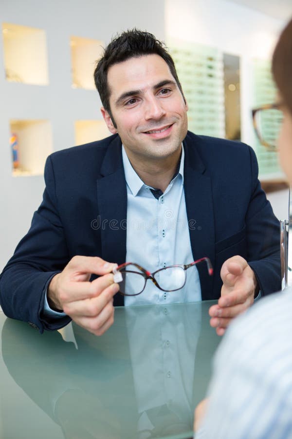 Man Buying Glasses at Optician Store Stock Image - Image of client ...