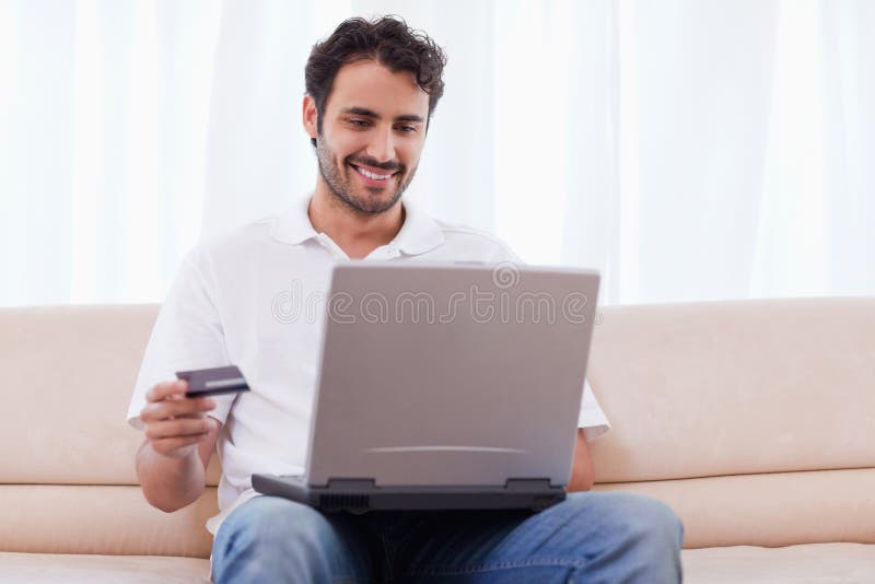 Man buying online stock photo. Image of purchasing, finance - 22234240
