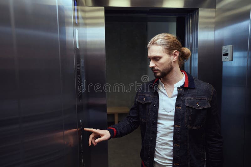 Man is in the Cabin of a Passenger Elevator Stock Photo - Image of ...