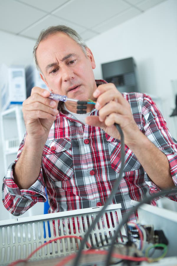 Man during Cable Reparation Stock Photo - Image of repairman, interior ...