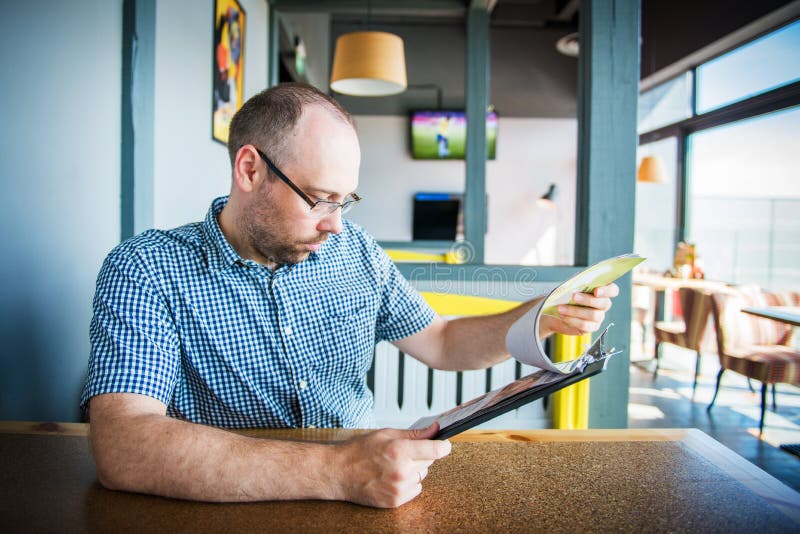 Man in a cafe stock image. Image of bold, cafe, restaurant - 58158431