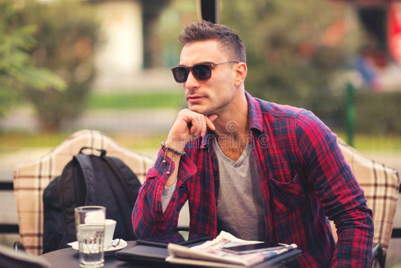 Man at a Cafe Table Reading a Newspaper Stock Photo - Image of coffee ...