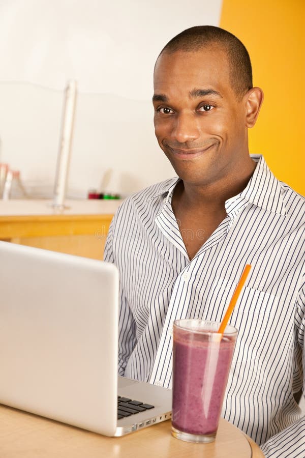 Man at Cafe Using Laptop stock image. Image of email - 14886409