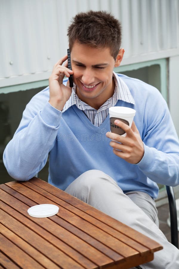 Man on a Call at Cafe stock image. Image of sweater, disposable - 36931723