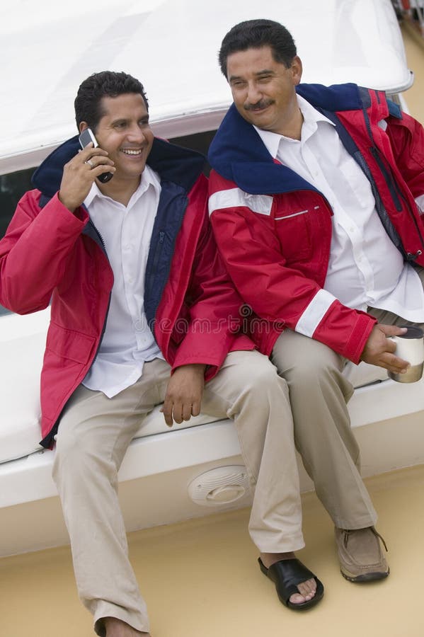 Man on Call with a Friend Sitting with Him Stock Photo - Image of adult ...