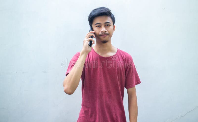 A MAN is CALLING a FRIEND stock photo. Image of casual - 188592590