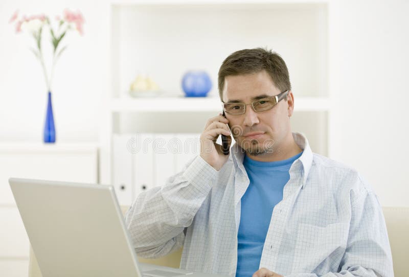 Man Calling on Mobile Phone Stock Image - Image of home, comfort: 7073221