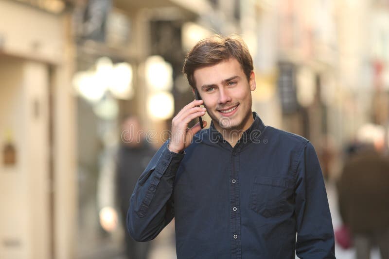 Man Calling on the Phone Walking on the Street Stock Image - Image of ...