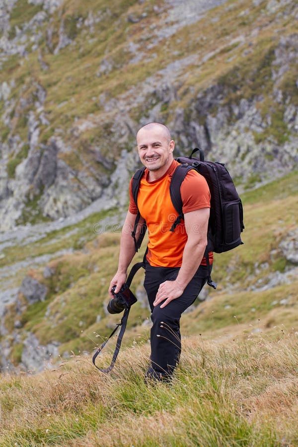 Tourist hiking with camera stock image. Image of hiker - 158634241