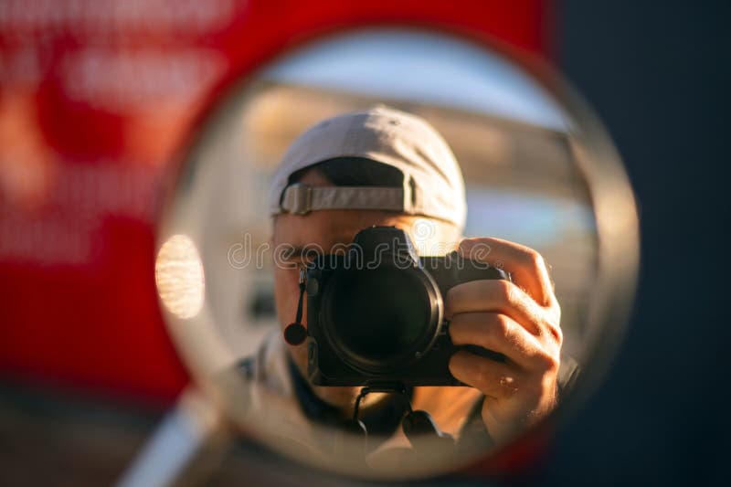 Man with a Camera Reflection in a Mirror Stock Photo - Image of focus ...
