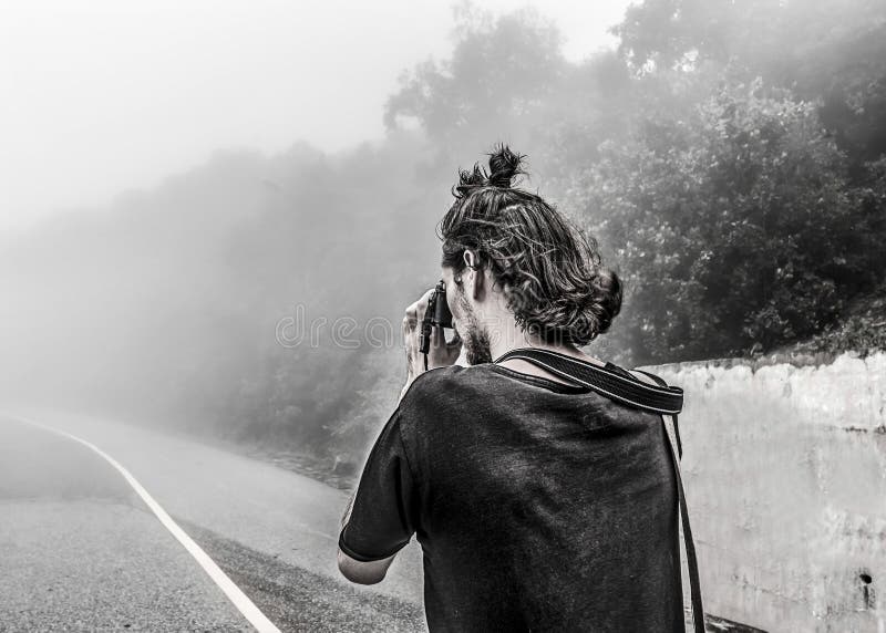 Man with Camera Shooting in a Fog Stock Image - Image of cold ...
