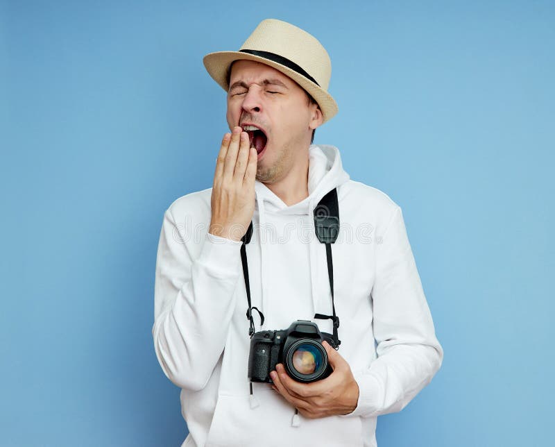 Man with the Camera is Tired and Yawns Stock Photo - Image of ...