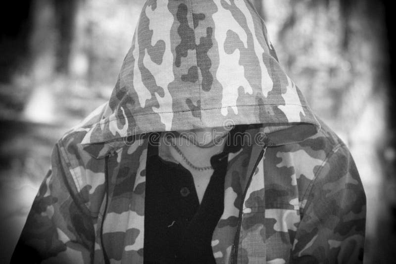 A Man in Camouflage with a Hood Pulled Down Stock Photo - Image of ...