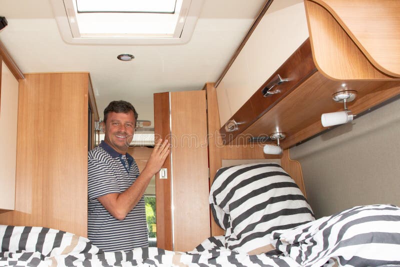 Man in Campervan Motor Home during Vanlife Vacation in RV Stock Photo ...
