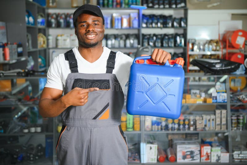 Man with Canister of Motor Oil in Auto Store Stock Photo - Image of ...