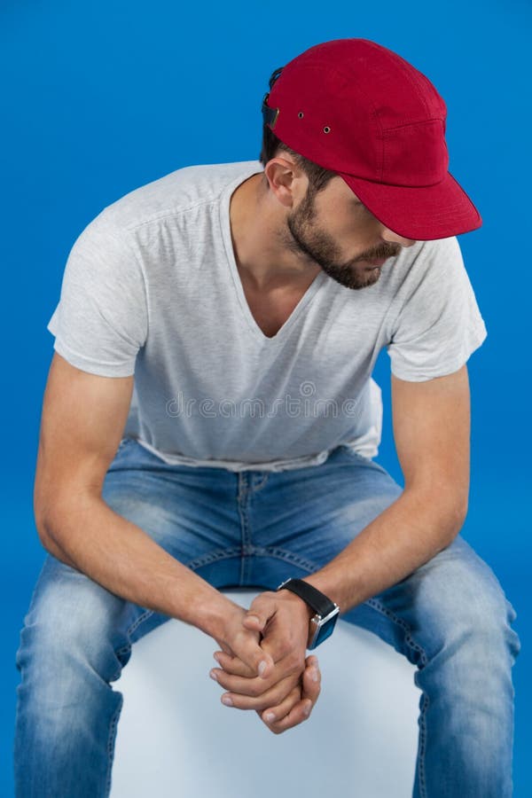 Man in cap stock image. Image of clothing, male, wristwatch - 84093377