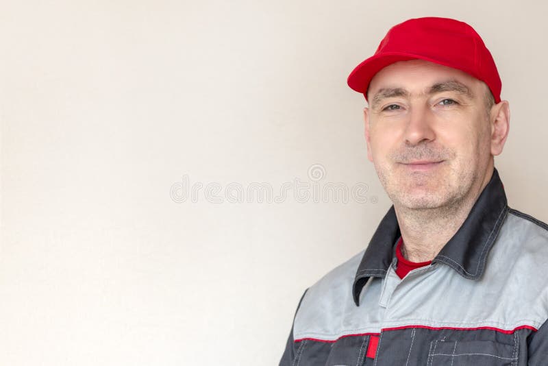Man in a Cap and Work Clothes. Working Man, Professional, Foreman Stock ...