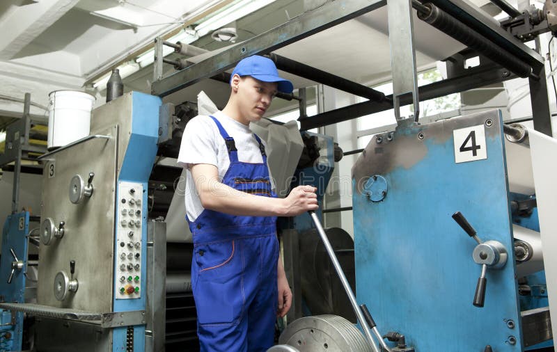 Man in Cap Working in Newspaper Factory Stock Photo - Image of paper ...