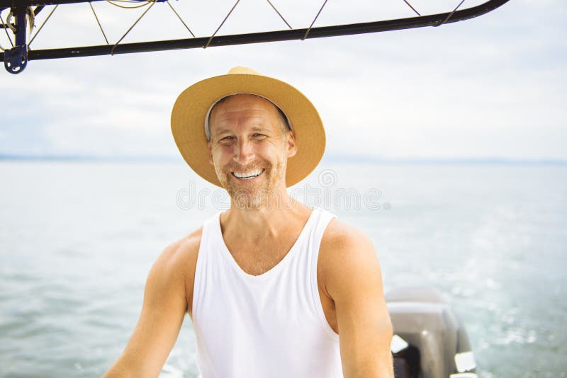 Man Captain Driving Boat on Ocean Tour Stock Photo - Image of happy ...