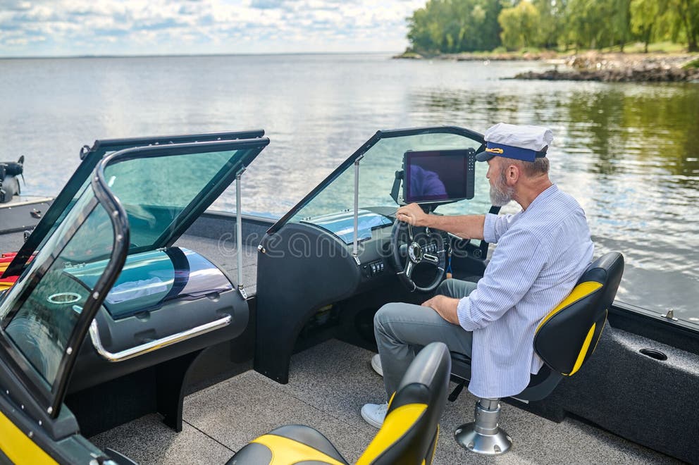 A Man in a Captains Cap Getting the Boat Ready Stock Image - Image of ...