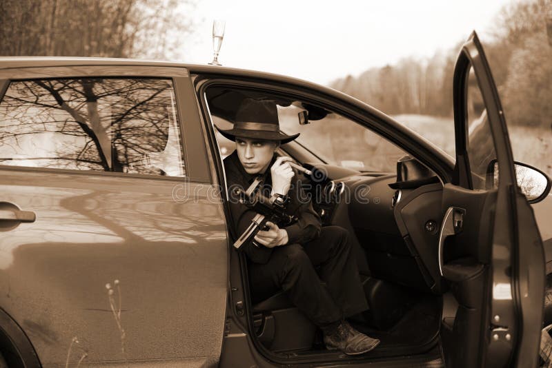 Man in car stock photo. Image of elegant, rifle, sitting - 8347324